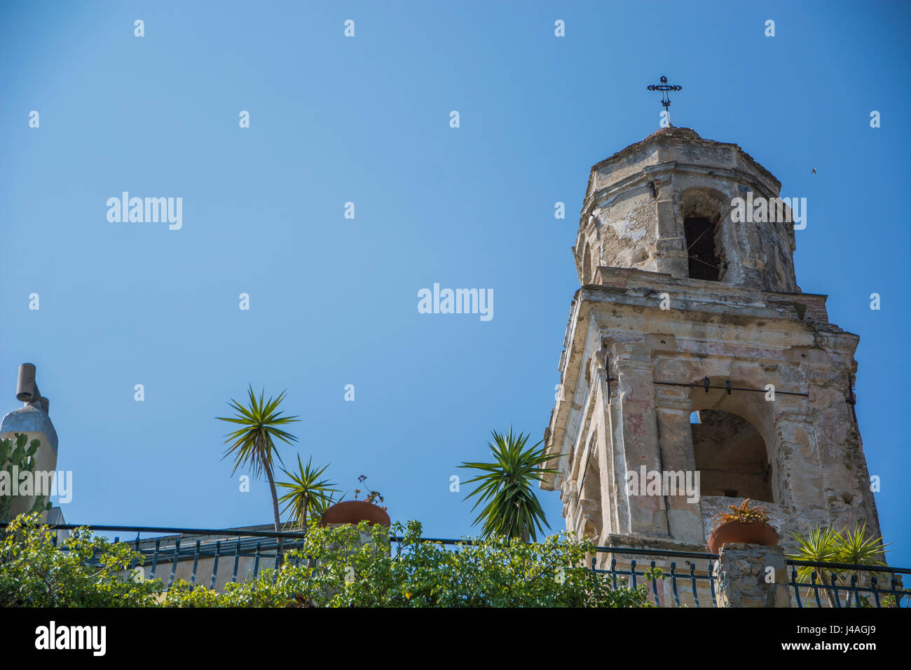 Old rustic bell-tower exterior in Italy Stock Photo - Alamy