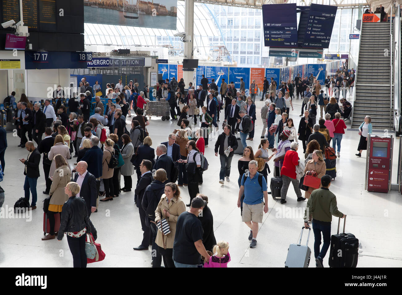 Commuters on Waterloo station Concourse in London during rush hour ...