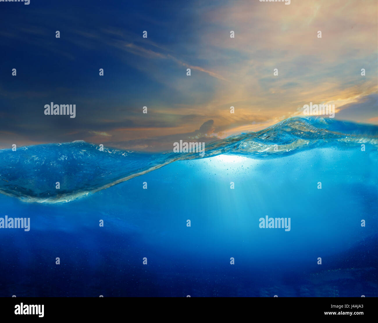 under sea water and sunset sky Stock Photo - Alamy