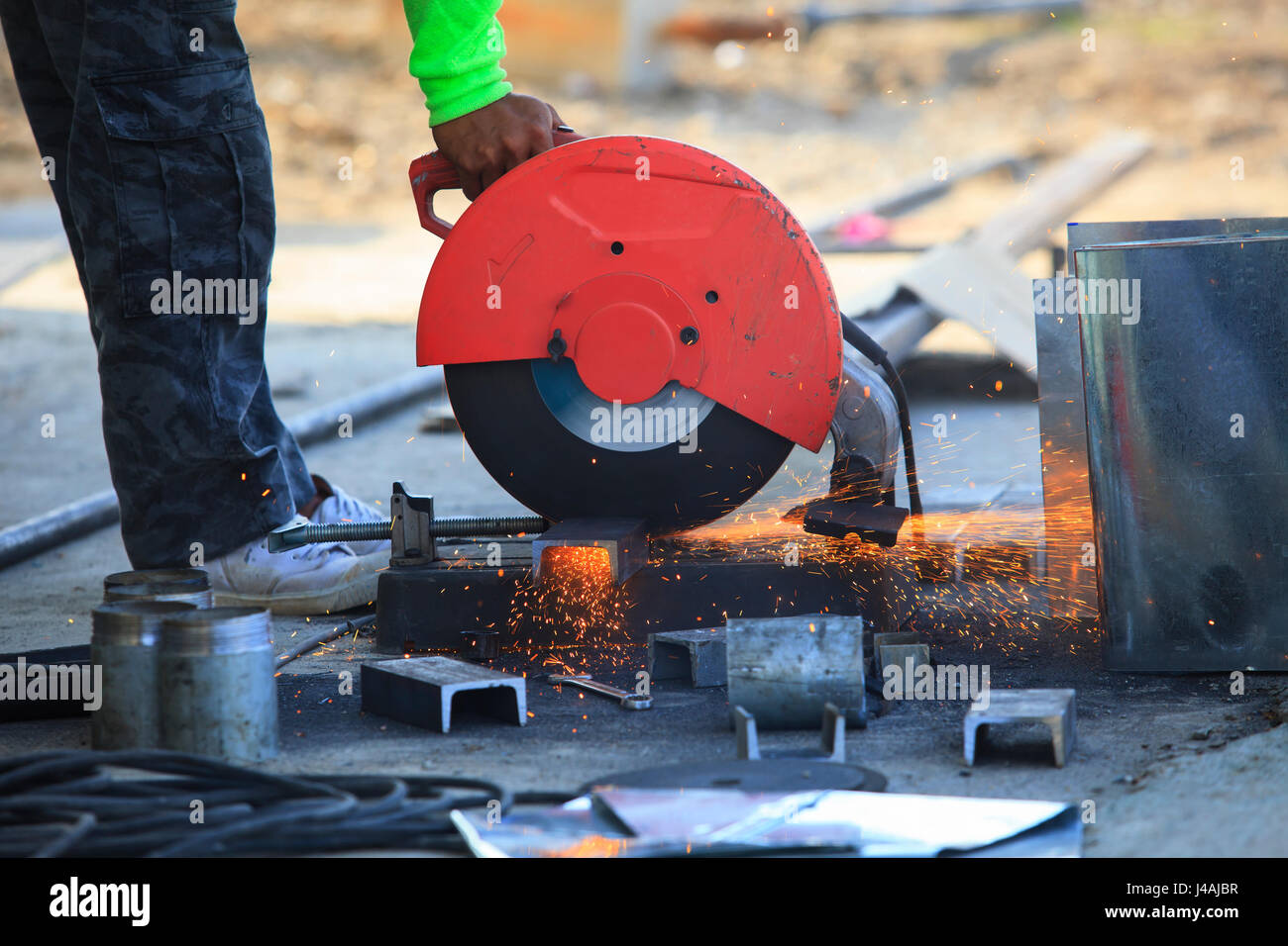 worker hand working by industry tool cutting steel with split fire use ...