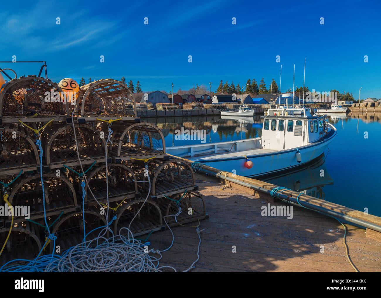 Commercial fishing boats at a wharf in rural Prince Edward Island ...
