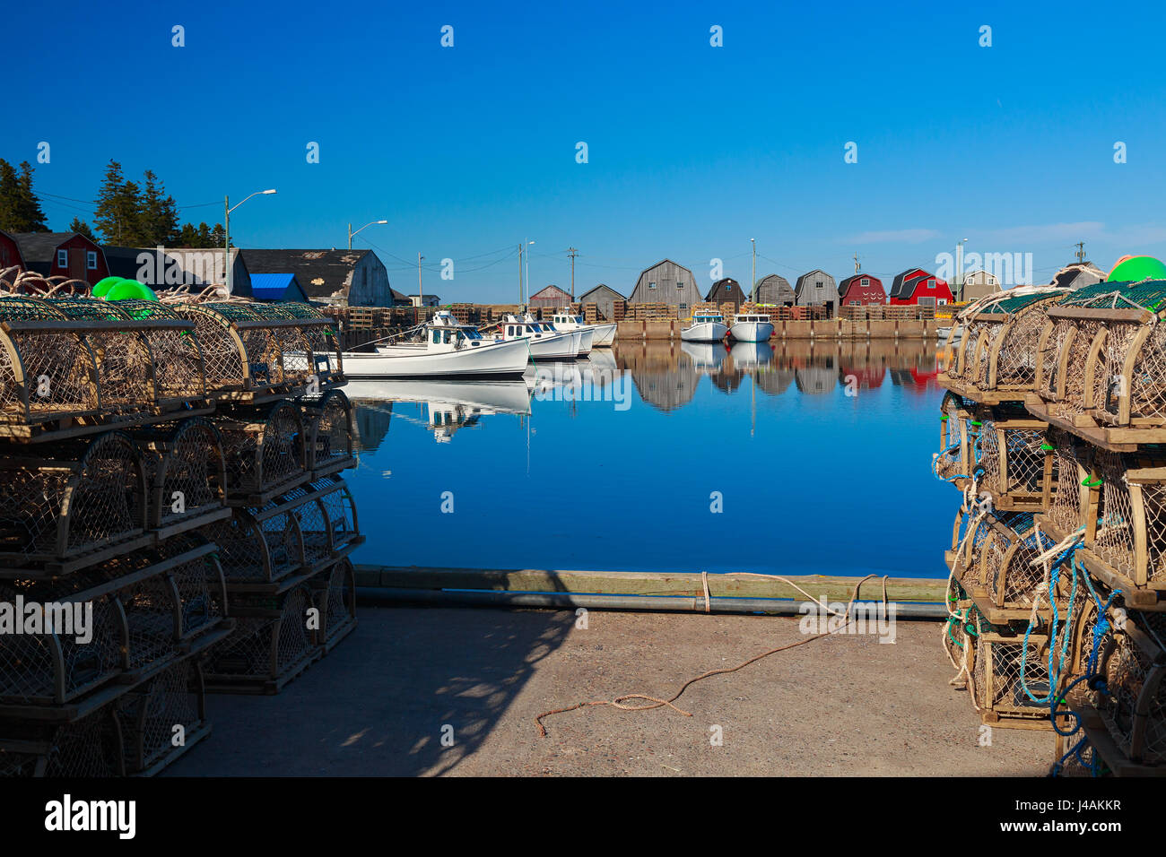 Commercial fishing boats at a wharf in rural Prince Edward Island ...