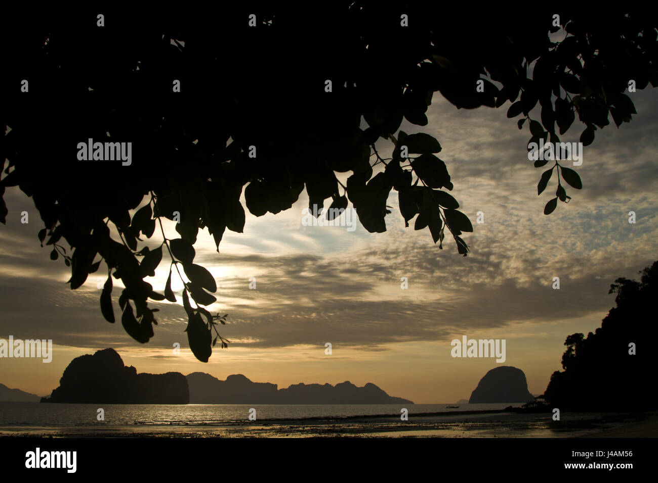 Sunset at beach on an island in Krabi Thailand Stock Photo - Alamy