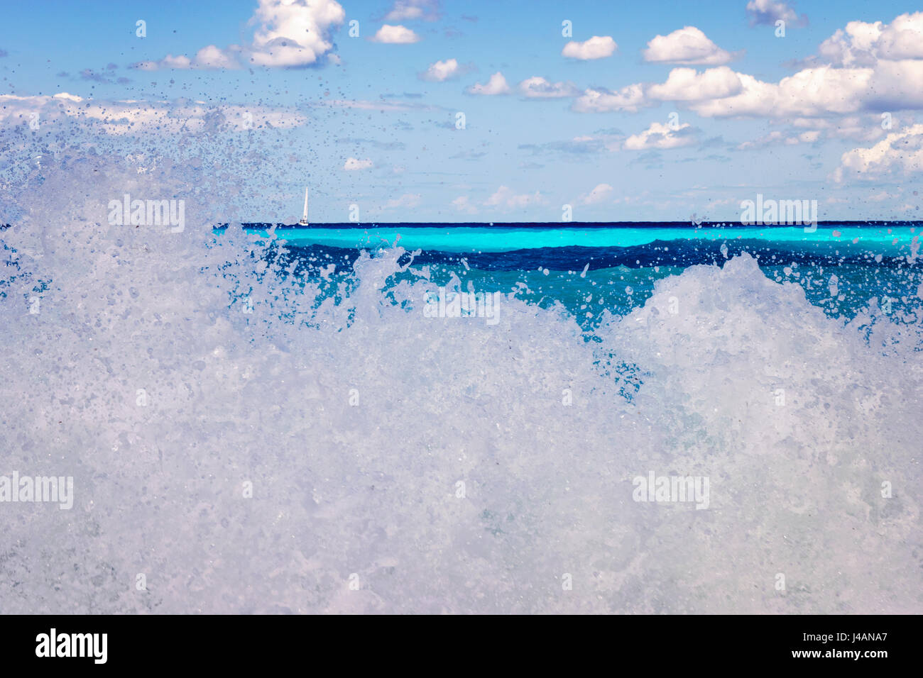 Waves breaking in beautiful blue hi-res stock photography and images ...