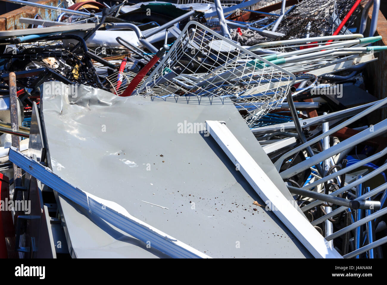 A pile of scrap metal waiting to be recycled Stock Photo - Alamy