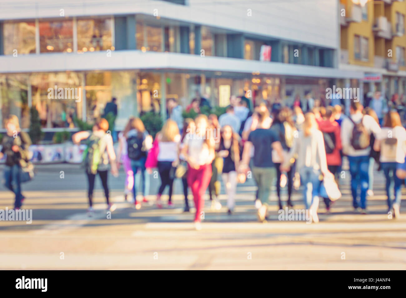 People rush on the street. Blurred crowd of different people are ...