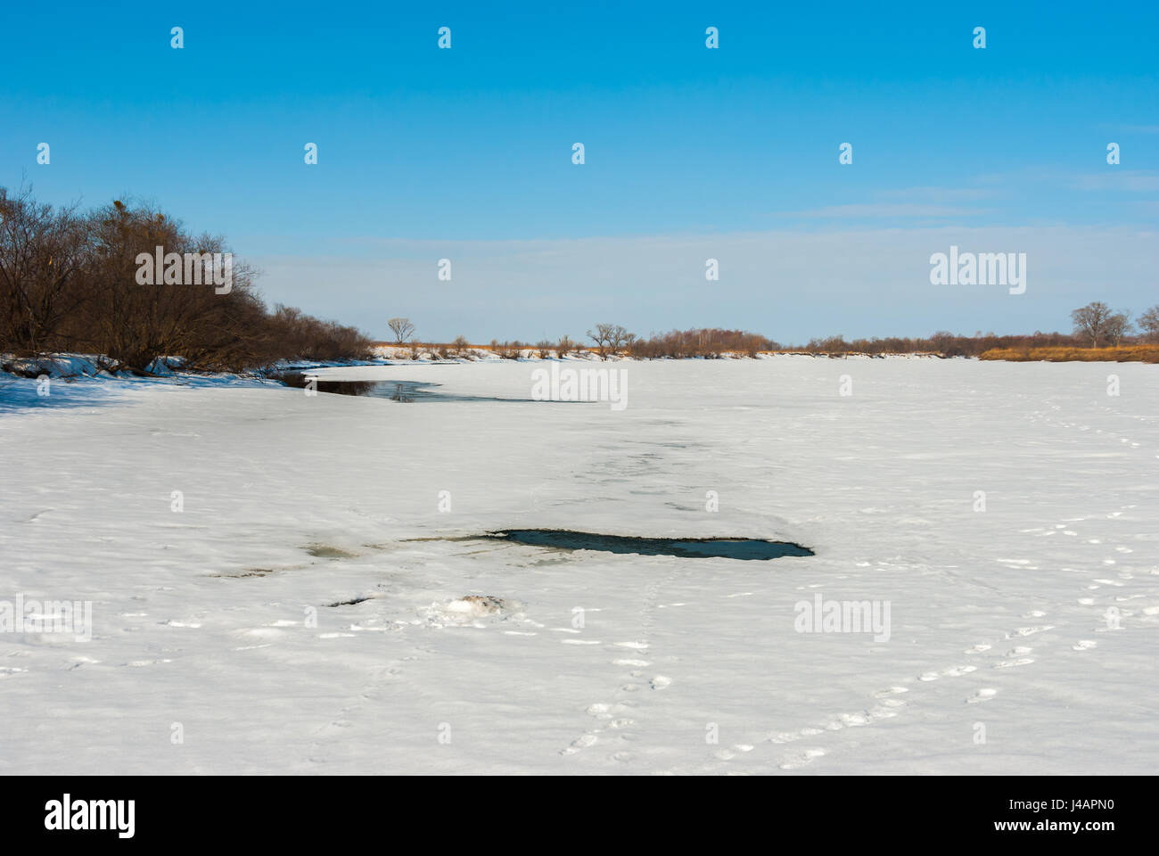 Winter landscape with frozen river Stock Photo - Alamy
