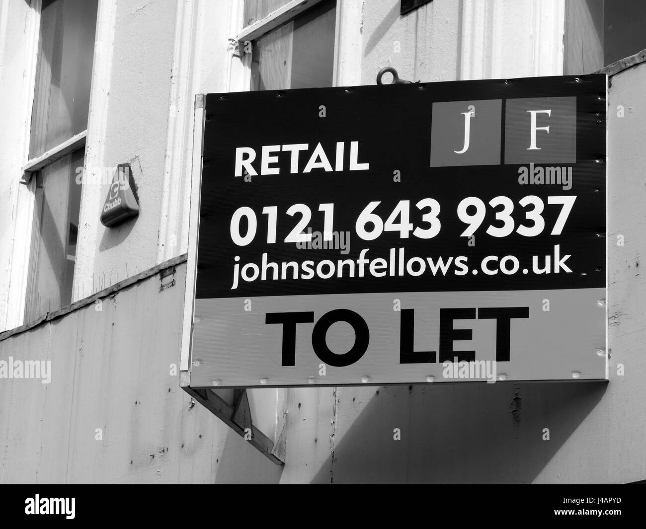 Monochrome commercial vacant shop to let sign over retail unit Stock ...