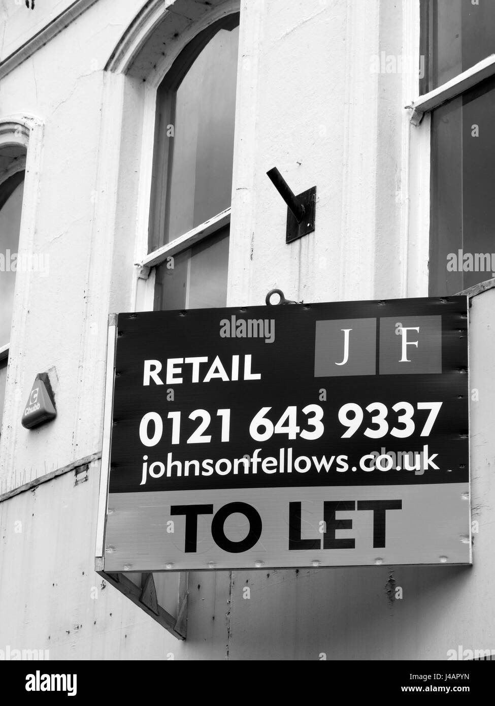 Monochrome commercial vacant shop to let sign over retail unit Stock ...