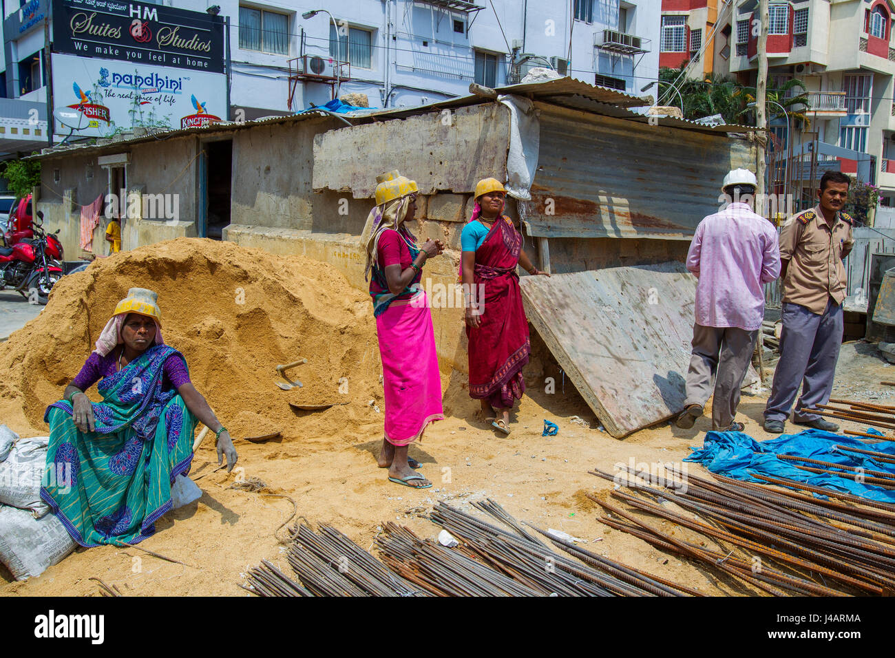 Indian womans in traditional clothes working at a building construction ...