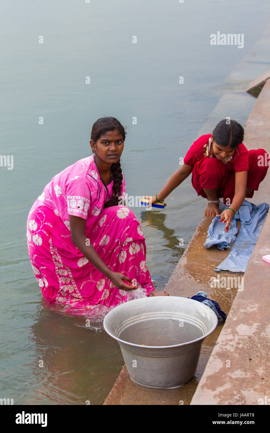 Indian people washing clothes at Tungabhadra Canal, Hospet, India Stock ...