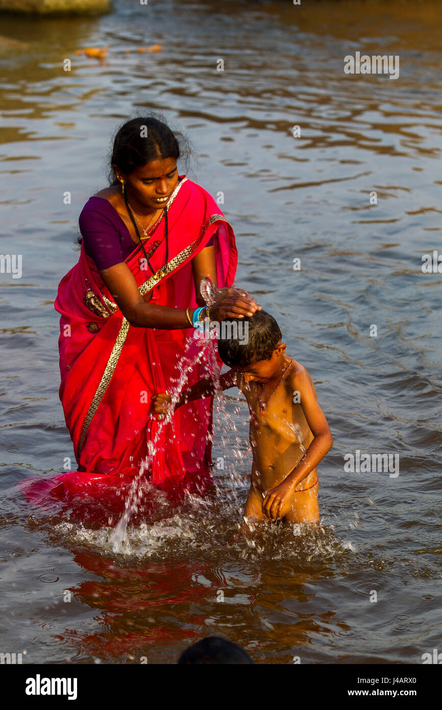 Indian people bathing on the Tungabhadra River, Hampi, Karnataka, India ...