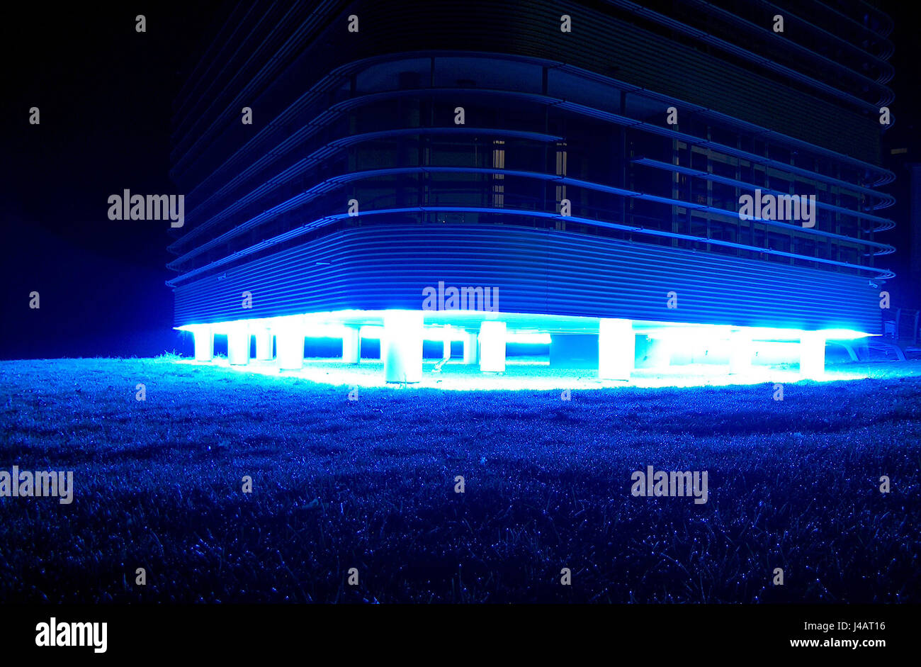 blue house building at night night photograph office building office ...
