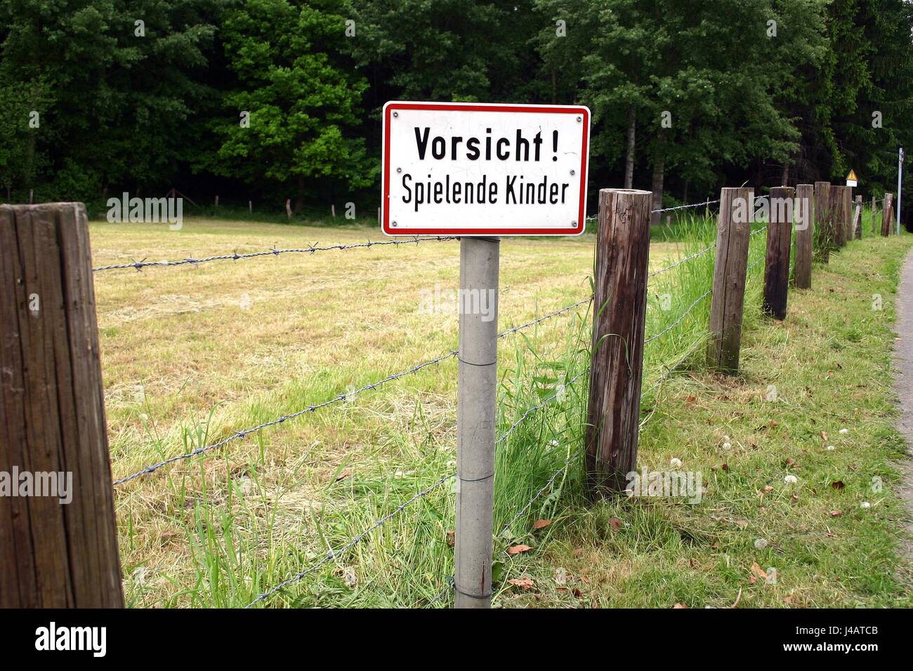 warning,dangerous! there's only barbed wire! Stock Photo - Alamy