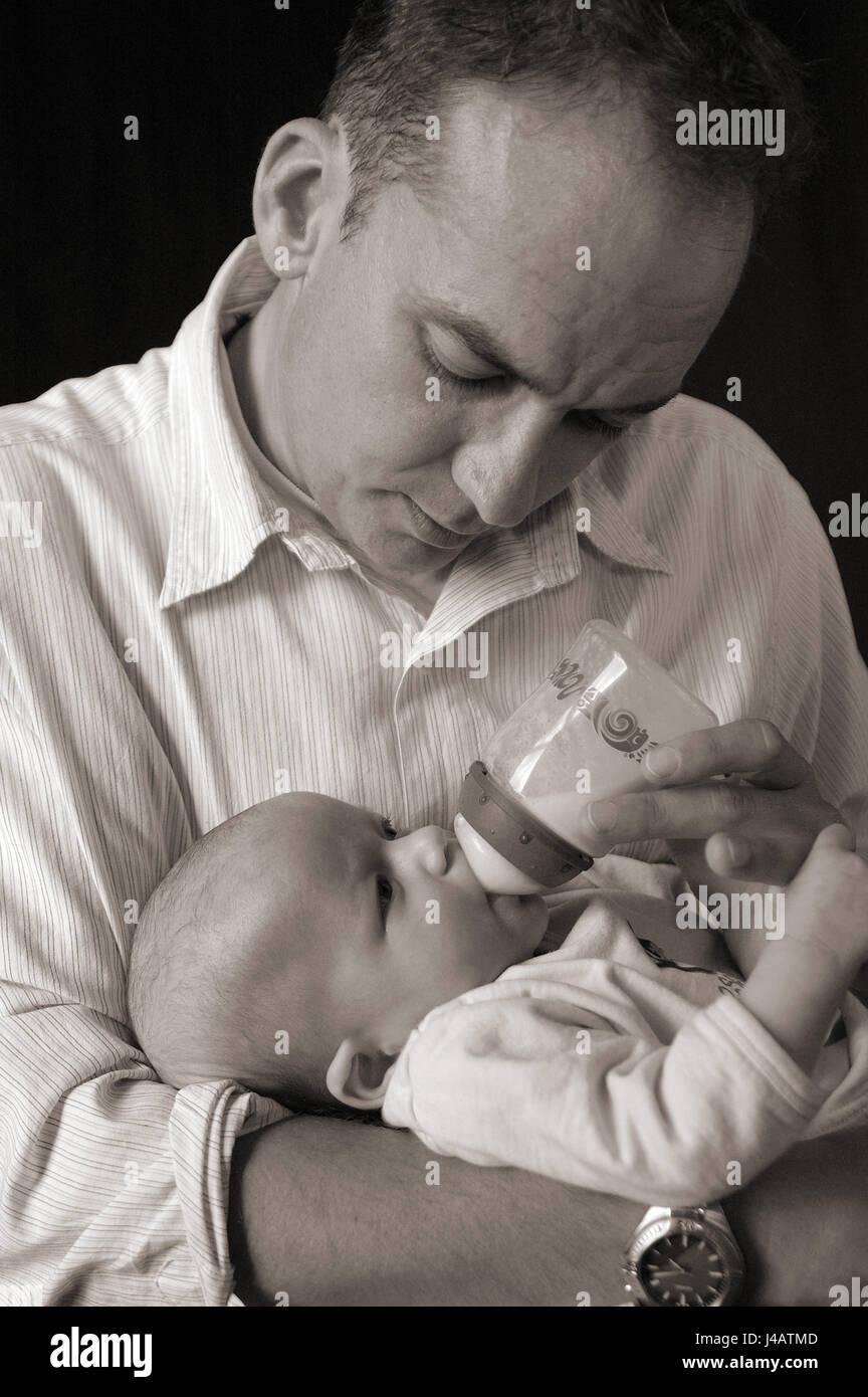 father breastfeeding daughter Stock Photo - Alamy