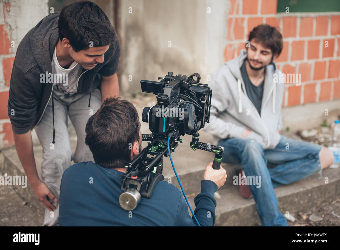 Behind the scene. Film crew team filming movie scene on outdoor ...