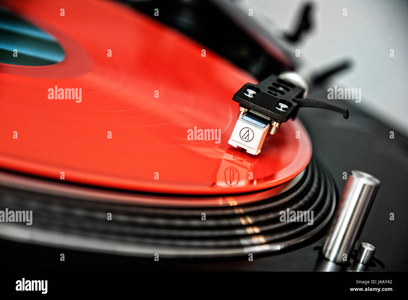 Pickup arm on red vinyl Stock Photo - Alamy
