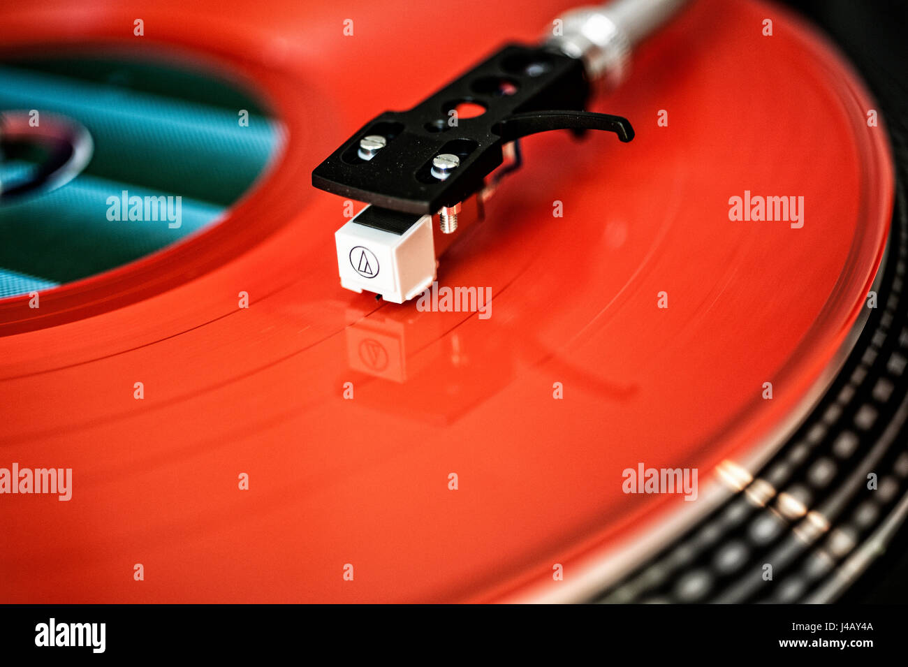Pickup arm on red vinyl Stock Photo - Alamy