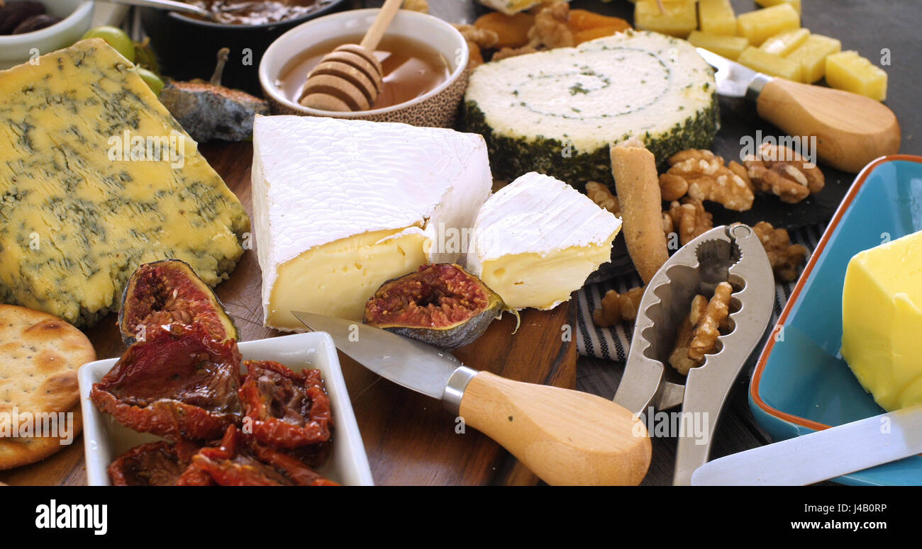 View of an assortment of French and British cheese with figs and ...