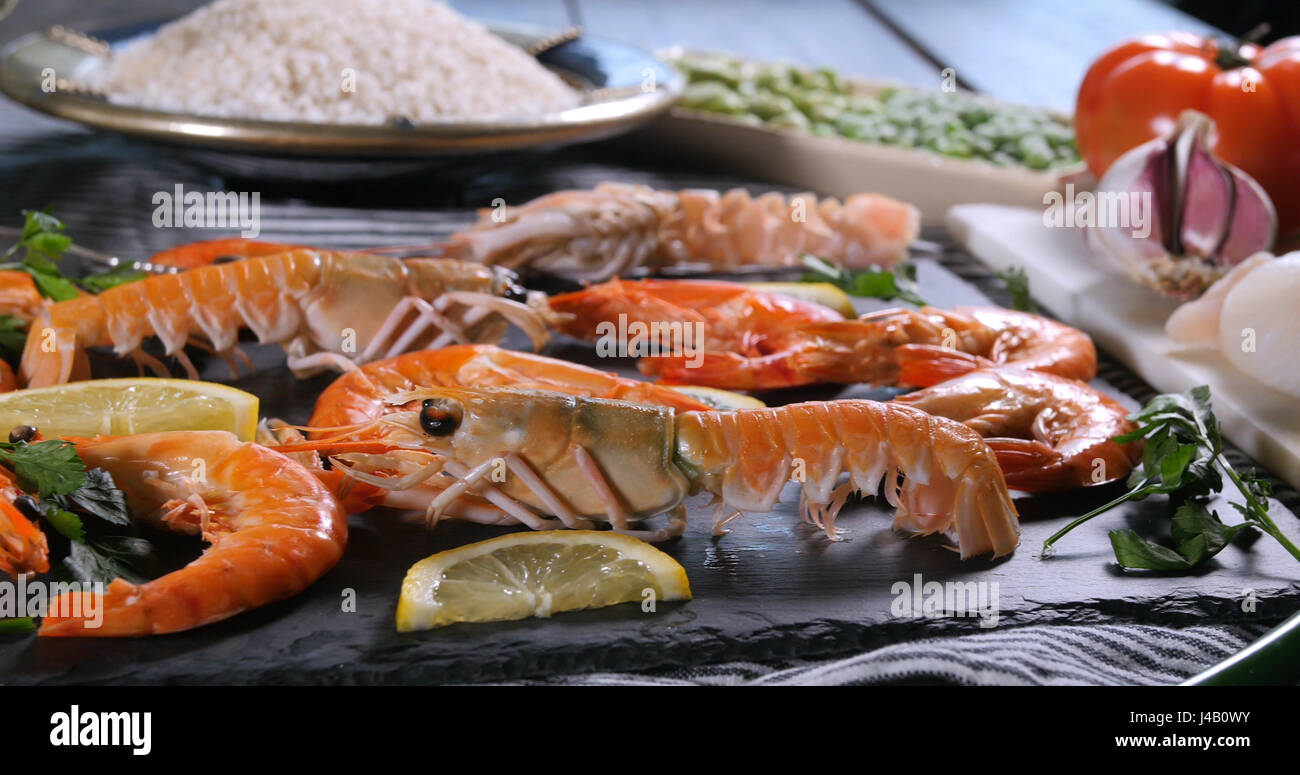 View of ingredient for a Spanish seafood paella: king prawns ...