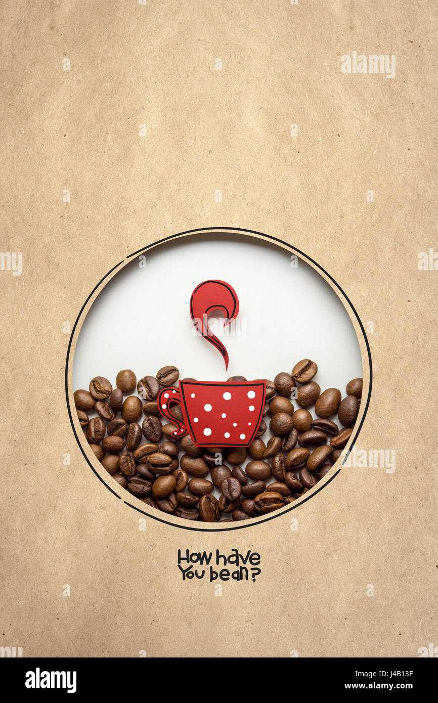 Creative concept photo of a cup of coffee made of paper on brown ...