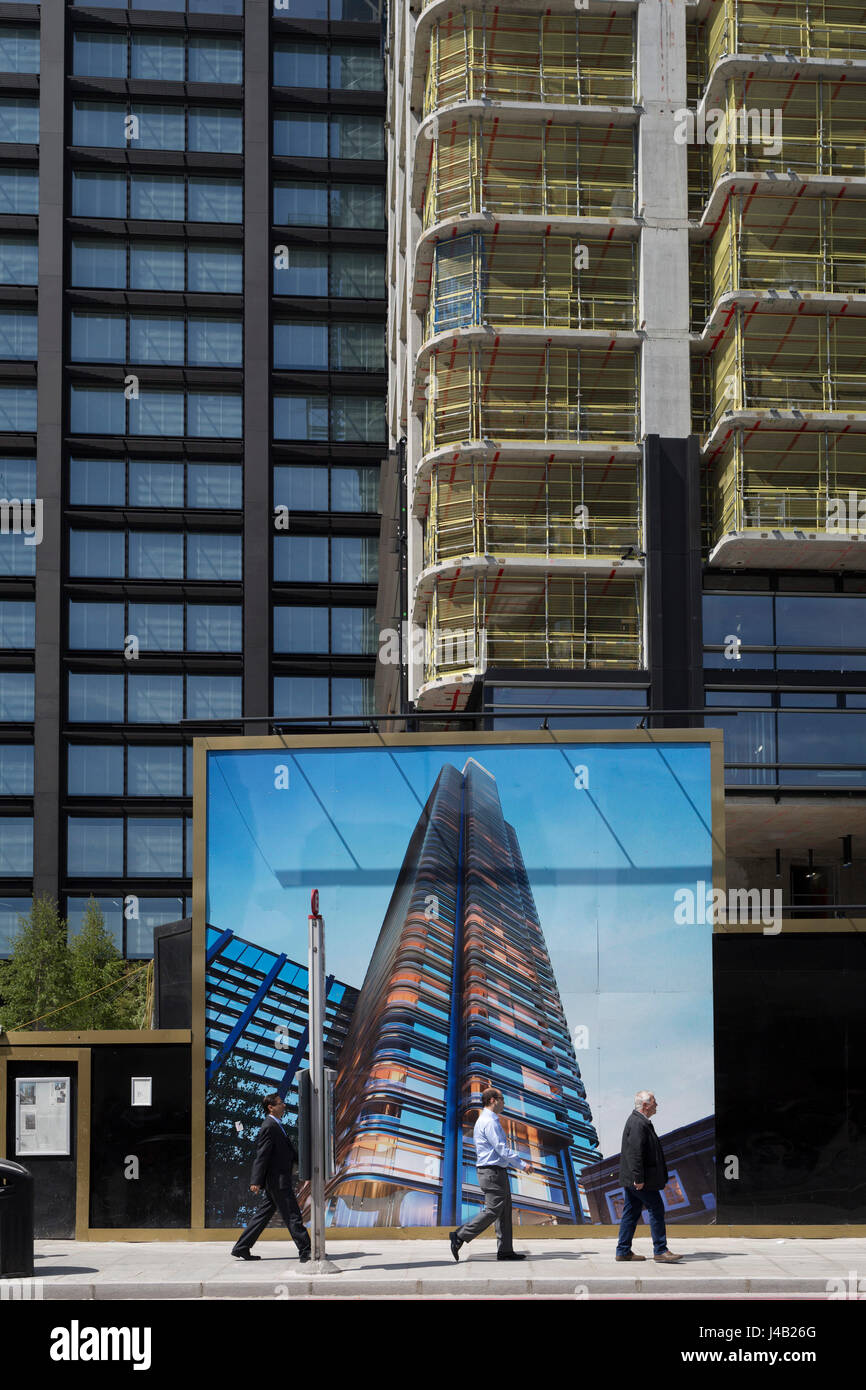 Passers-by and a construction hoarding showing the Foster-designed ...