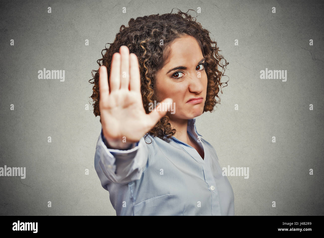Closeup portrait young annoyed angry woman with bad attitude giving ...