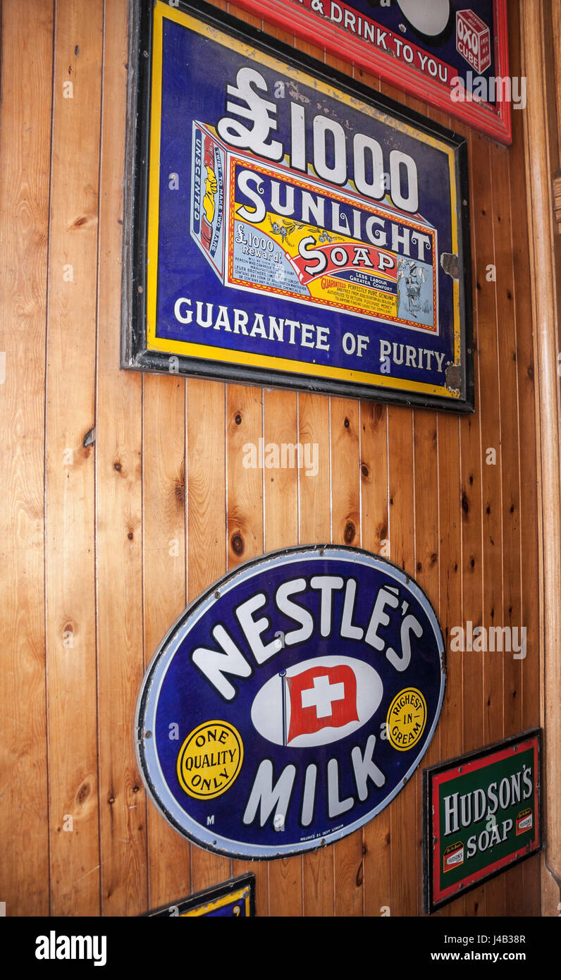 Old signs on the wall in a shop at Beamish Museum,England,UK. Nestles ...