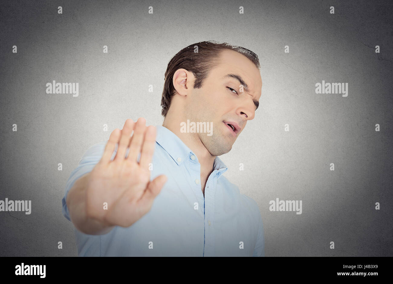 Closeup portrait young handsome grumpy man with bad attitude giving ...