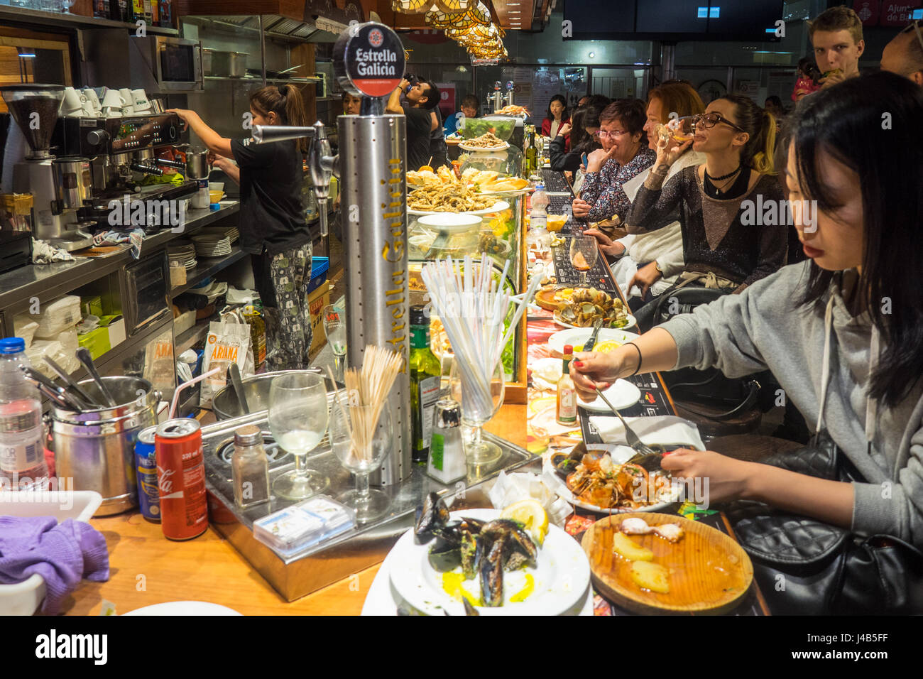 People eating tapas bar in hi-res stock photography and images - Alamy
