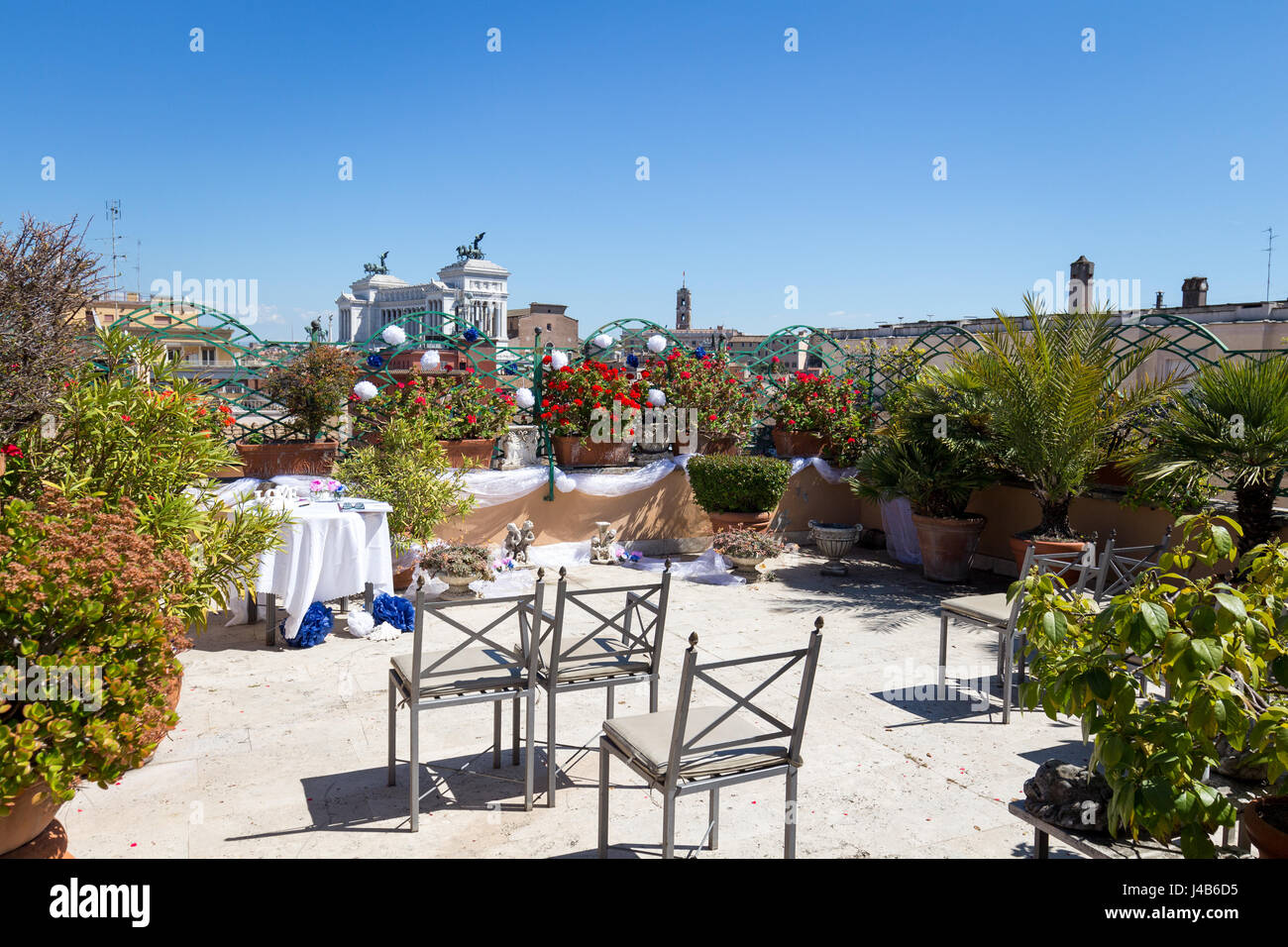 Wedding decor, table setting, floral arrangements on the rooftop ...