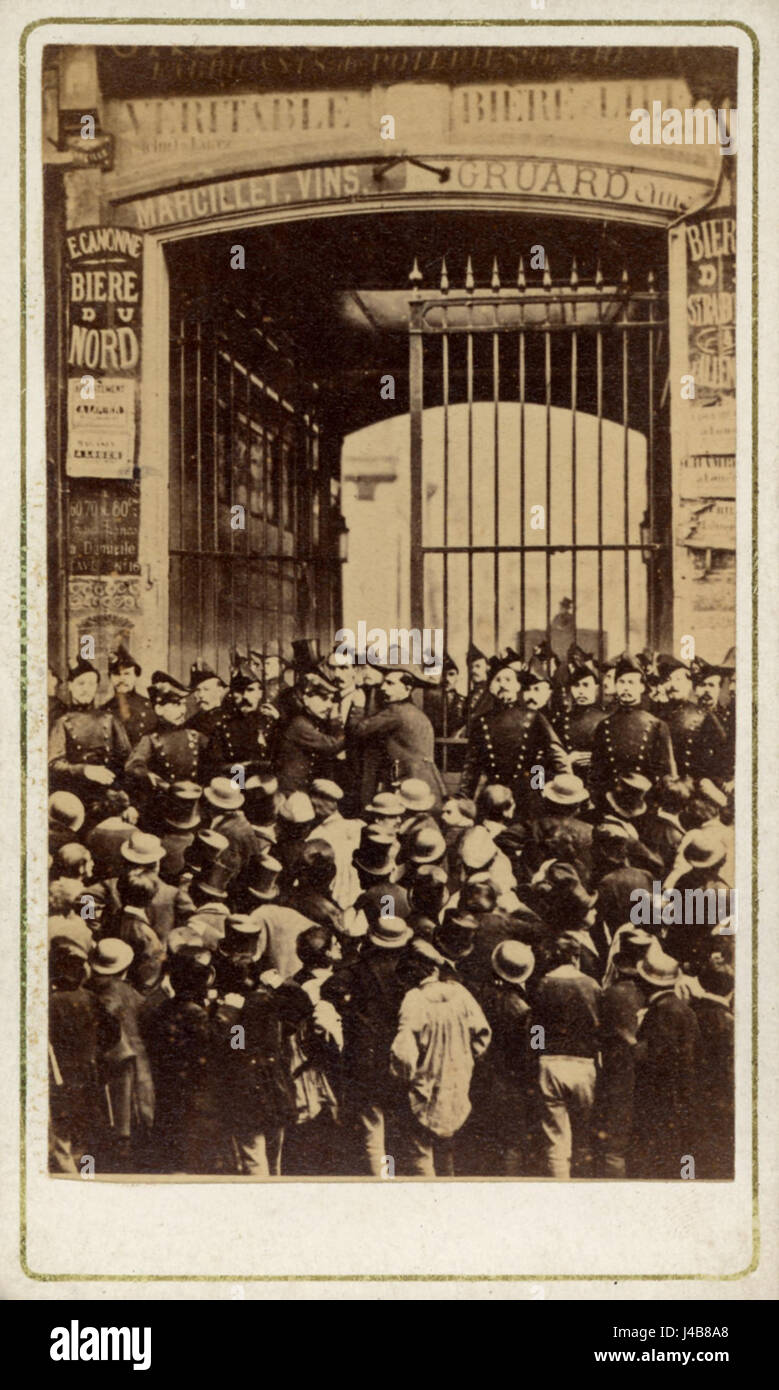 Police and crowd outside gate Stock Photo - Alamy