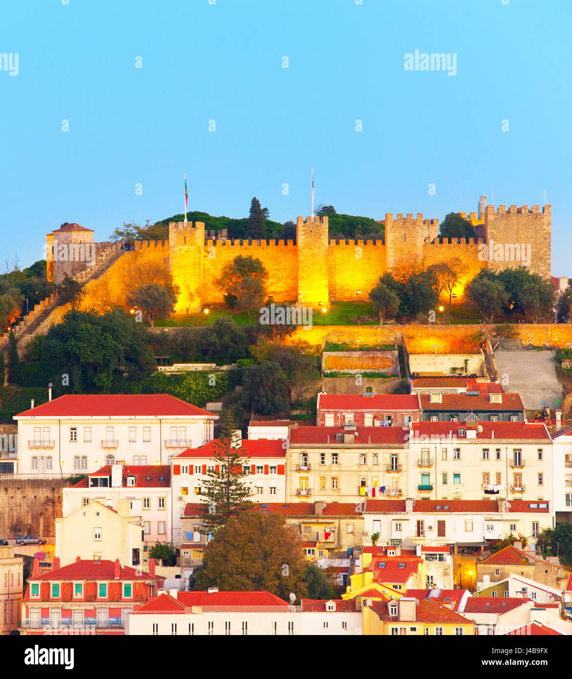 Lisbon Castle on a top of a hill at dusk. Lisbon, Portugal Stock Photo ...