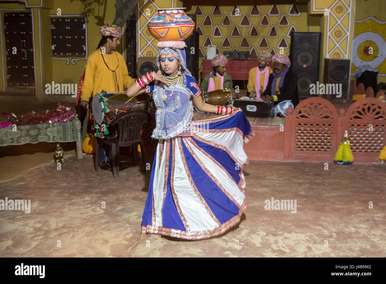 Indian woman dancing with pot on her head Stock Photo - Alamy