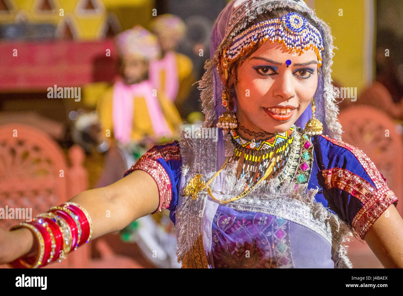 Indian woman in head dress dancing Stock Photo - Alamy