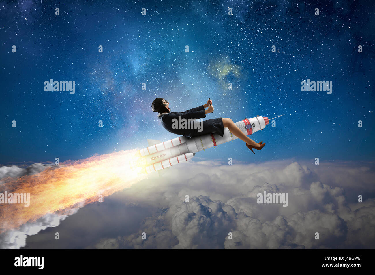 Woman riding missile. Mixed media Stock Photo - Alamy