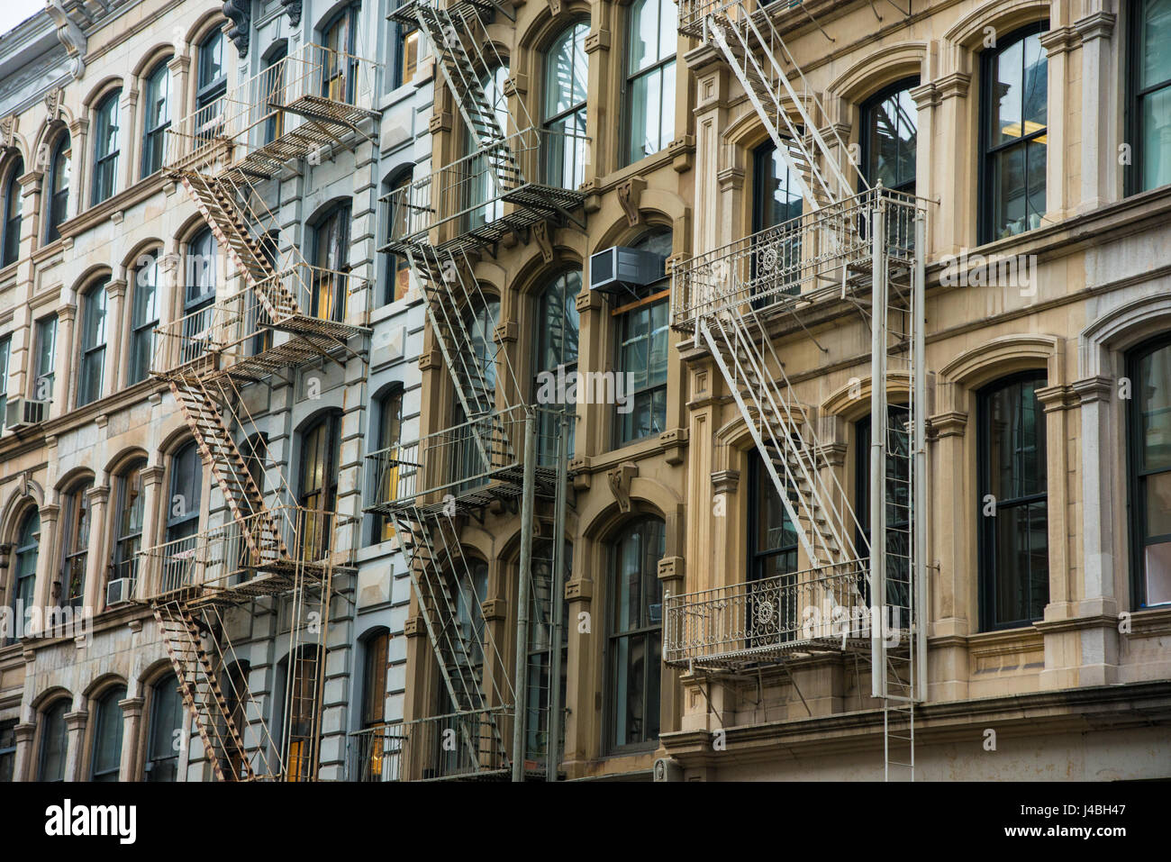 Office building with fire escapes in Soho district of New York City ...