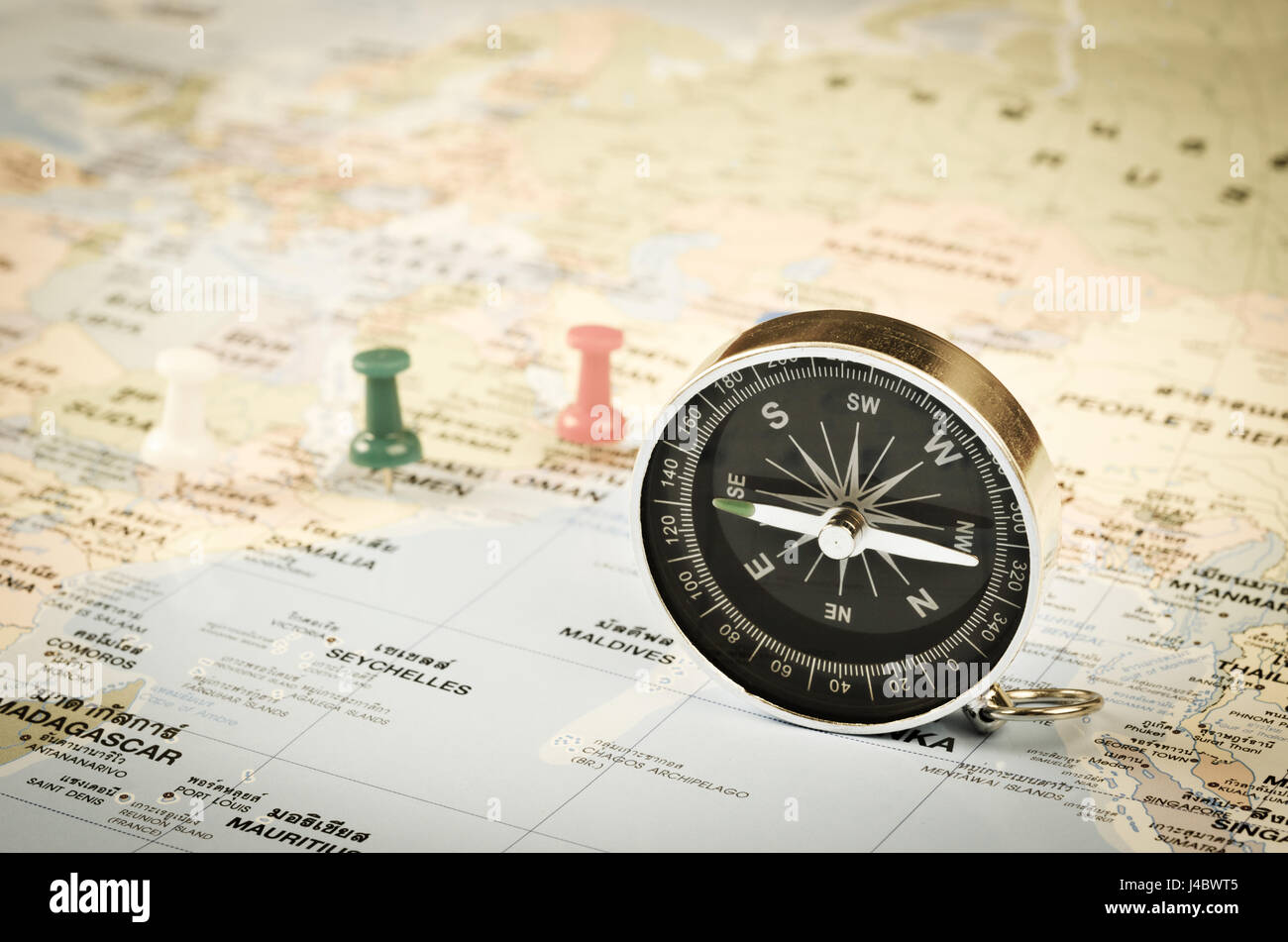 Compass on world map, Tourism and exploration concept Stock Photo - Alamy