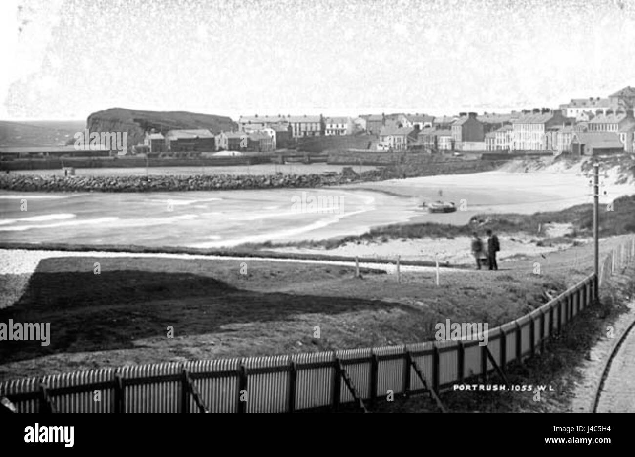 This image captures a panoramic view of Portrush, a coastal town in ...