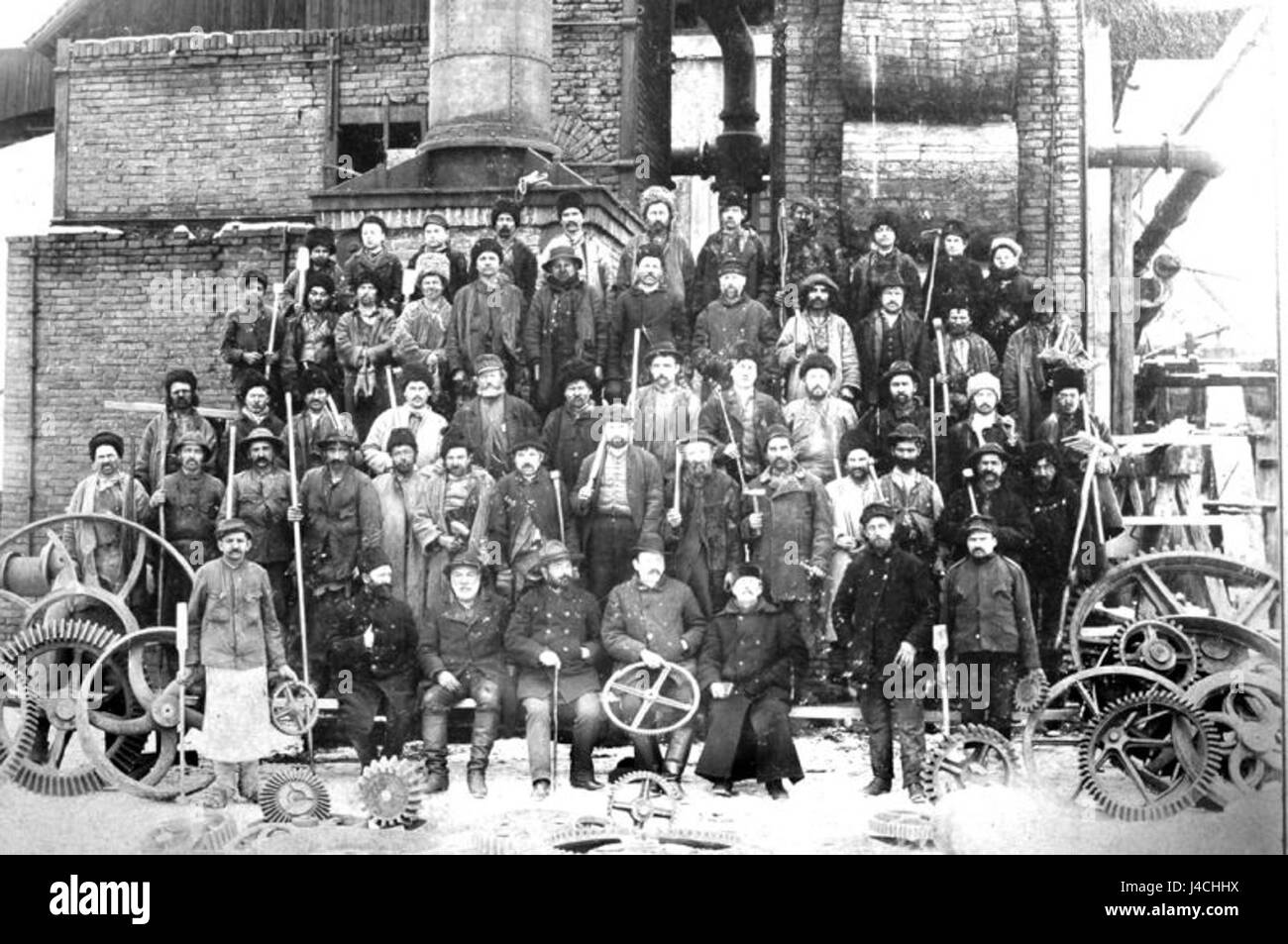 A historical photograph from 1890 showing the staff of a blast furnace ...