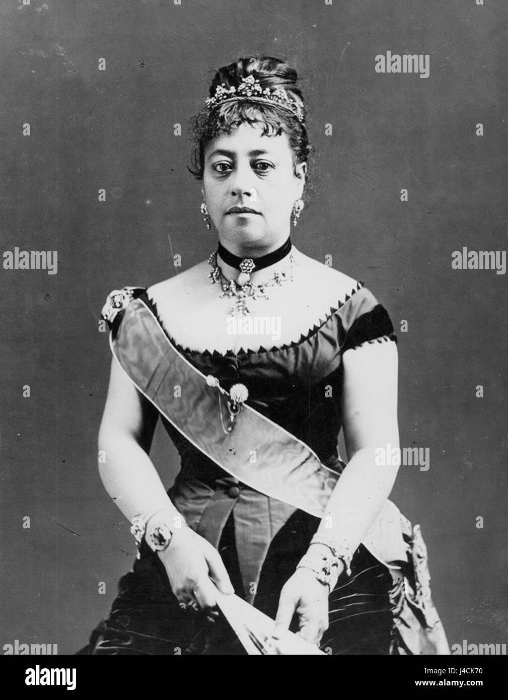 This photograph, taken by A. A. Montano, depicts Queen Emma of Hawaii ...
