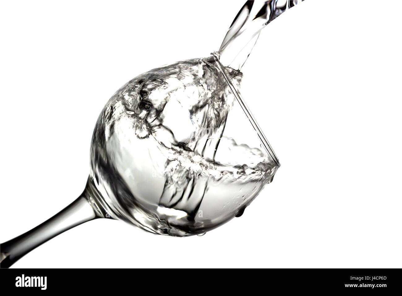 Colorless liquid, water,vodka is poured into a glass, liquid in a ...