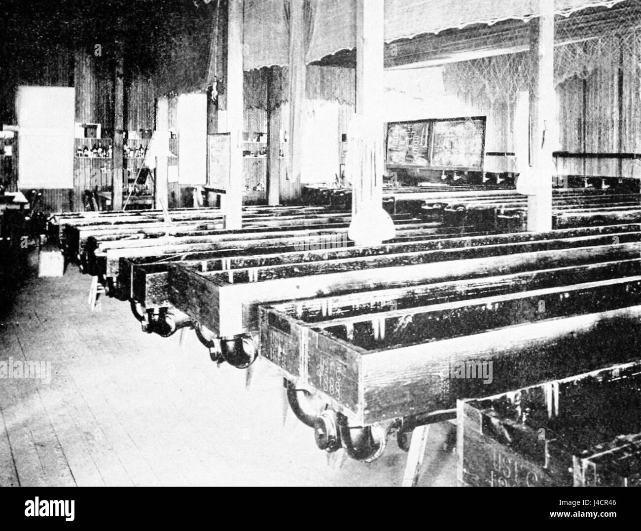 This illustration shows the lower ends of troughs with outlet pipes ...