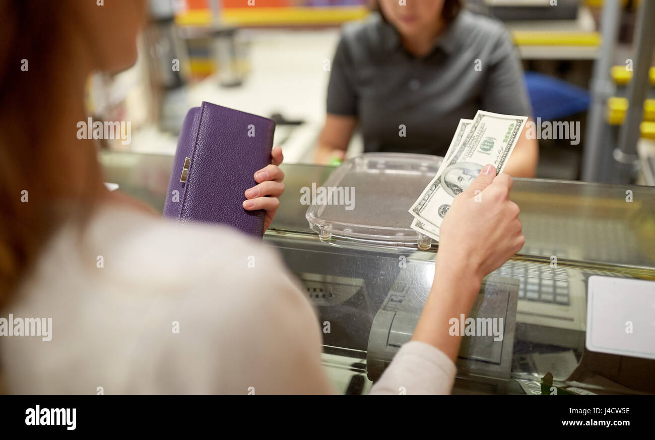 woman paying money at store cash register Stock Photo - Alamy