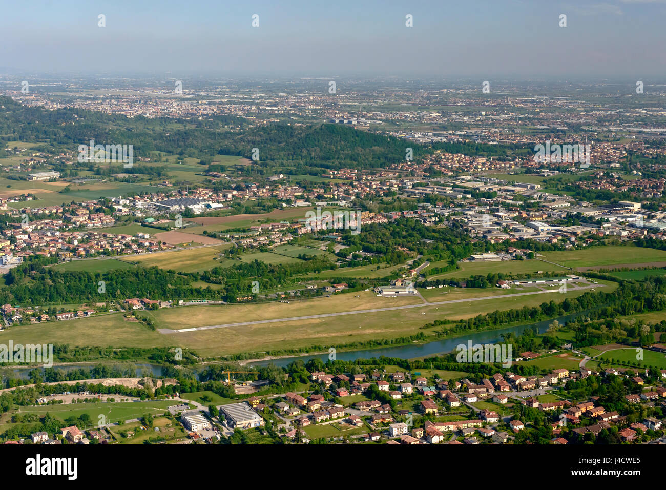 aerial shot, from a small plane, of amall Valbrembo airfield, shot on a ...