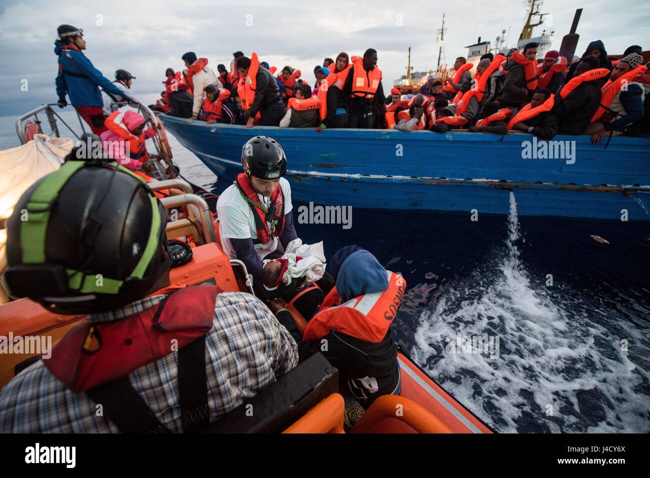 Approximately 380 refugees in a wooden boat and 130 in a rubber boat ...