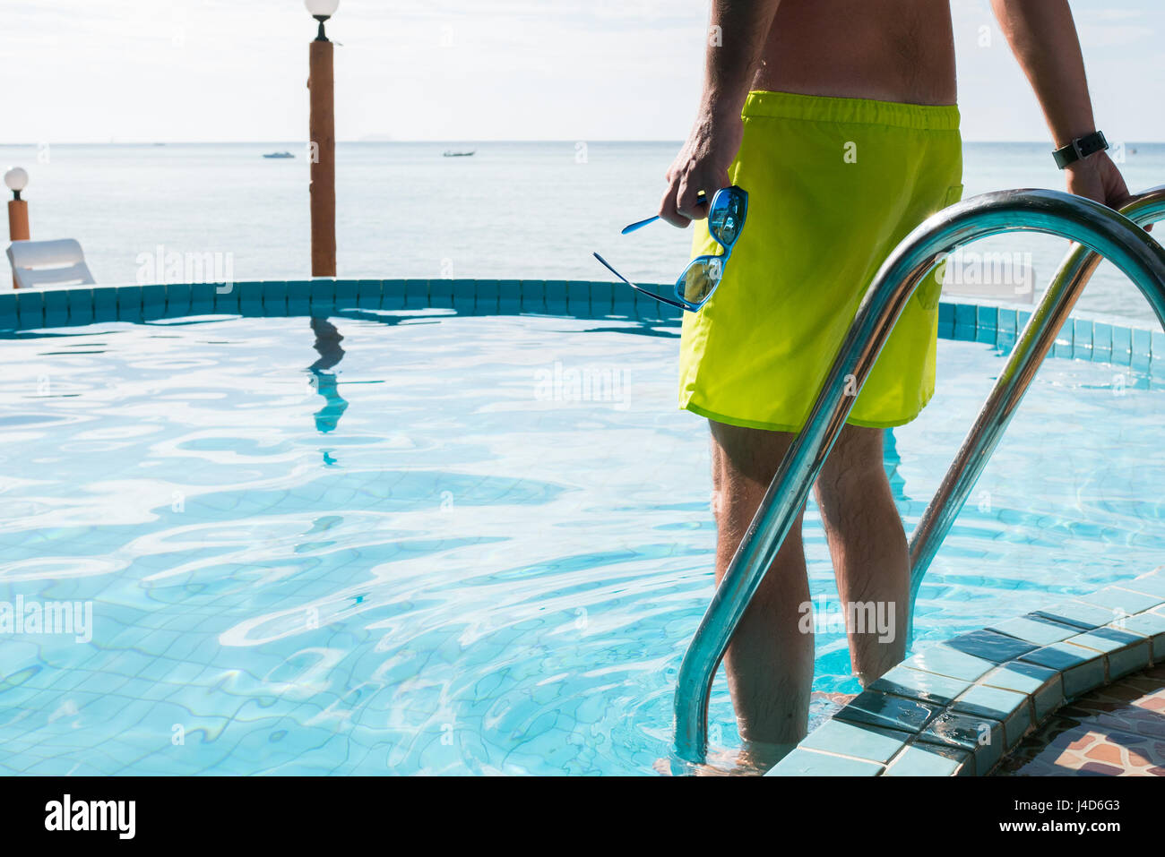 Picture of guy in pool Stock Photo - Alamy