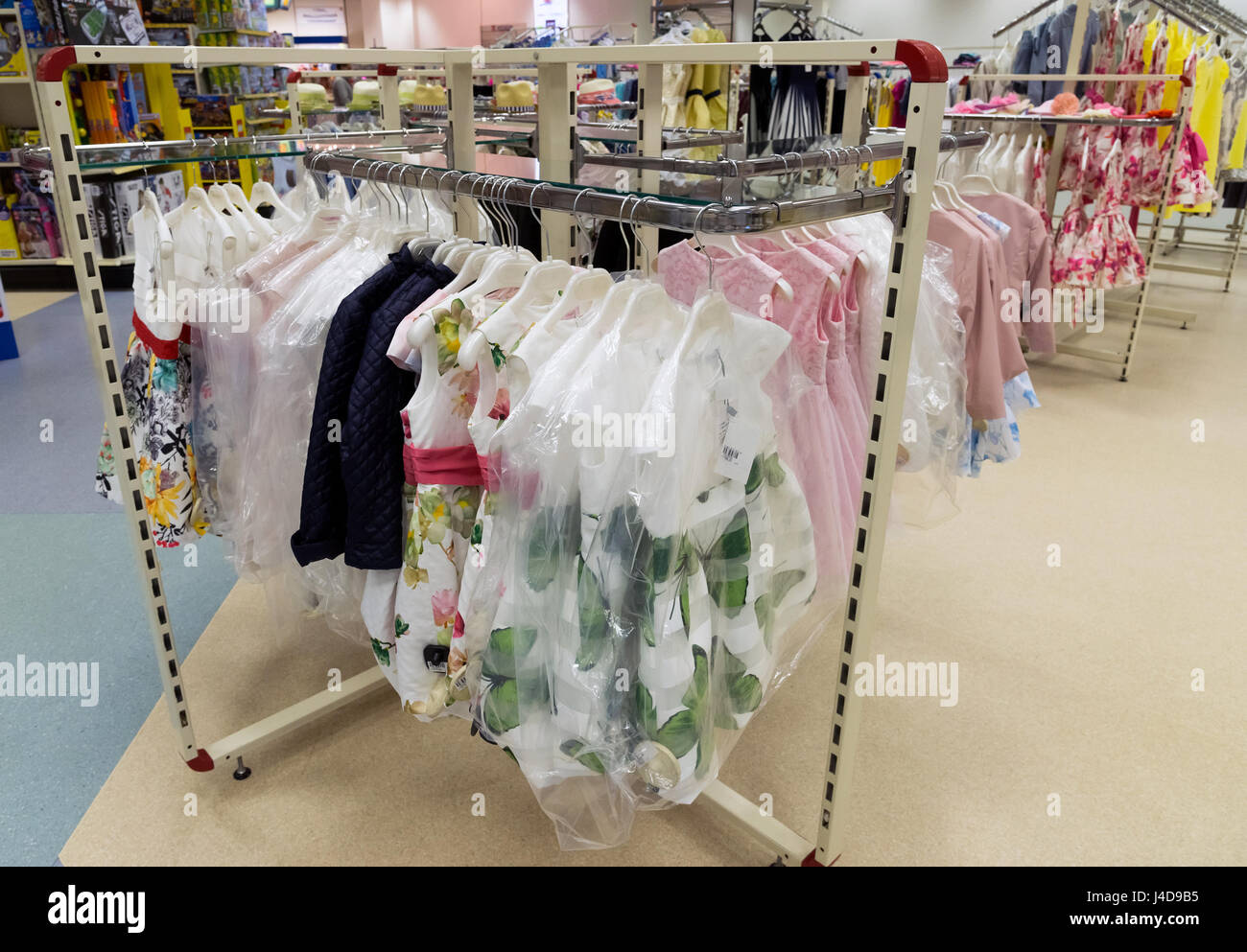 Elegant dresses for girls in the store Stock Photo - Alamy