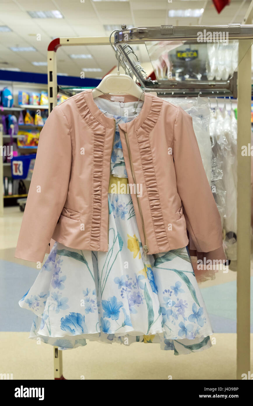 Fancy dress and jacket for girls in the shop Stock Photo - Alamy