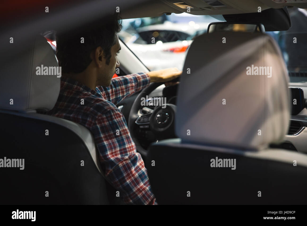 Handsome young man driving a modern car Stock Photo - Alamy